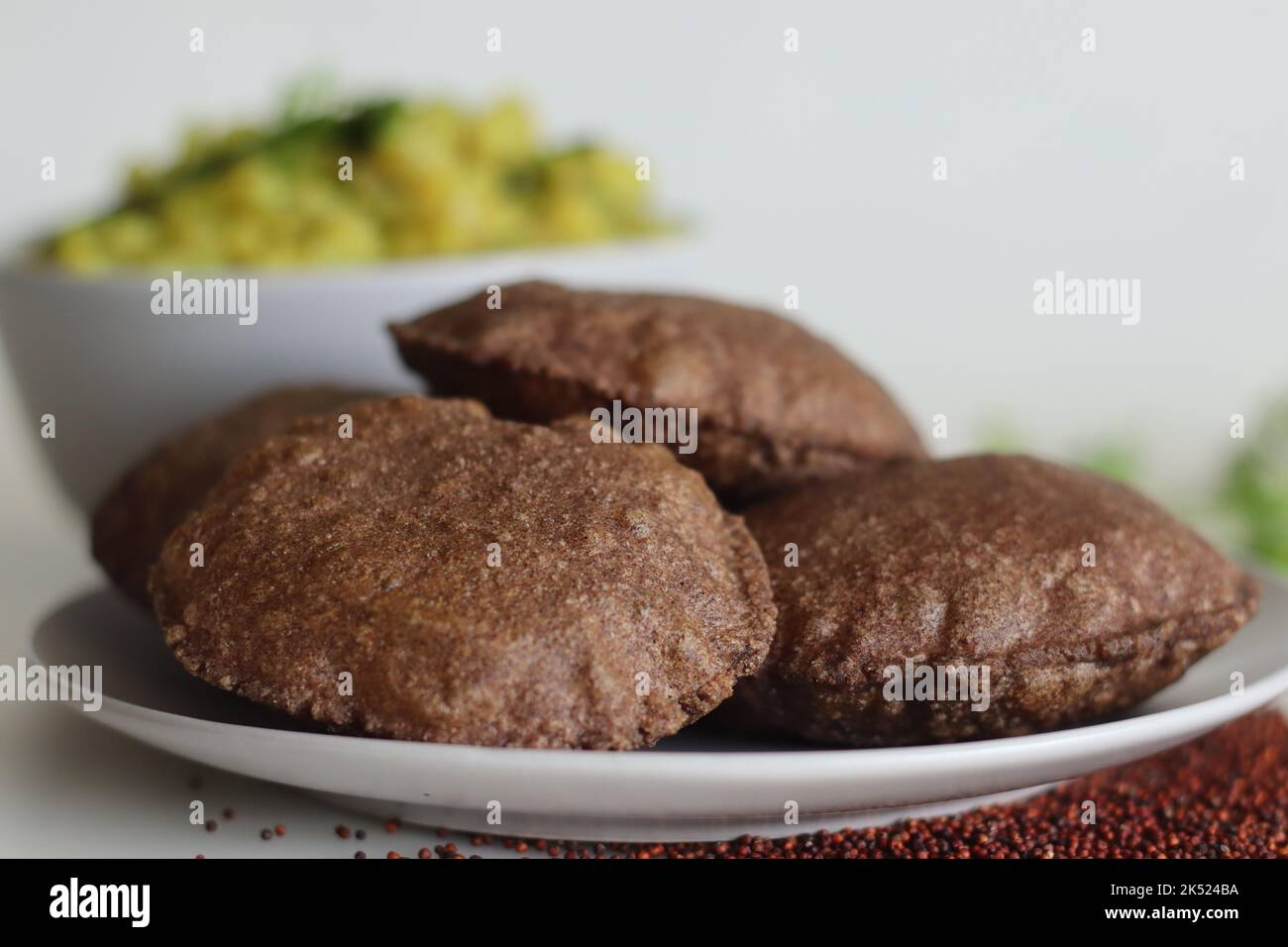 Ragi Poori served with spiced mashed potatoes as side dish. Deep fried ...