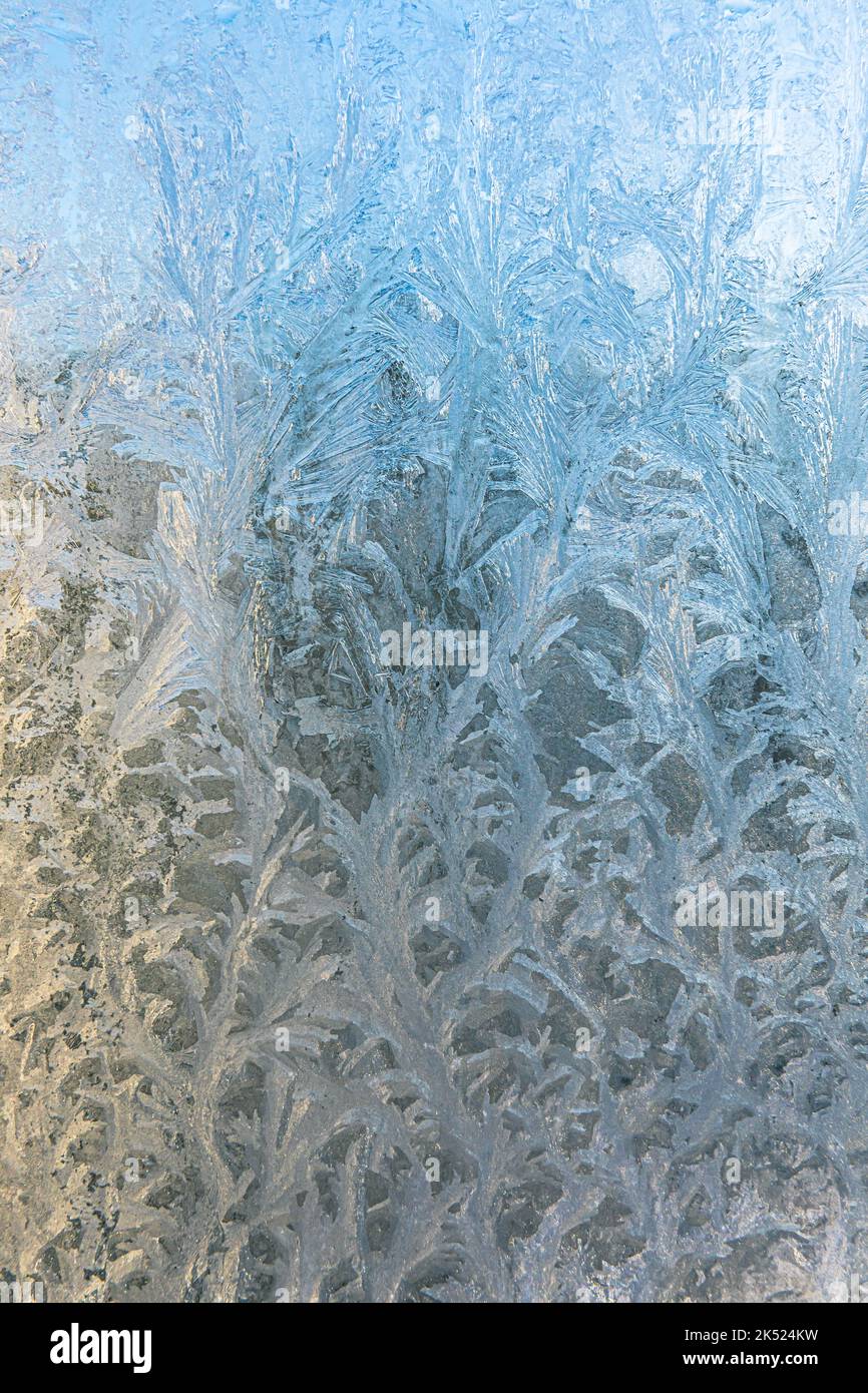 Frozen winter window with shiny ice frost pattern texture. Christmas ...