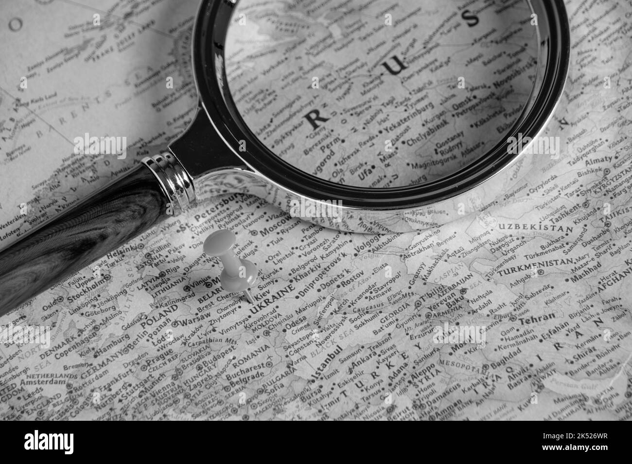 Under a magnifying glass on map is territory Russian Federation, in ...