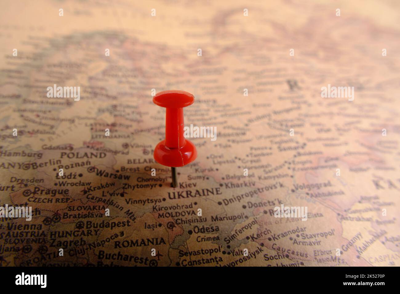 Bright sunlight illuminates territory Russia world map.Red button is ...