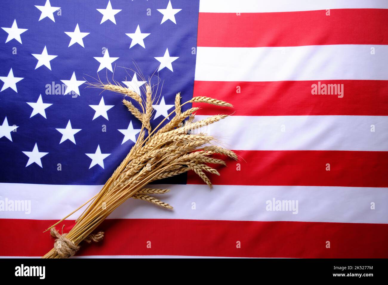 Flag of United States America and bunch wheat ears lying on it Stock ...