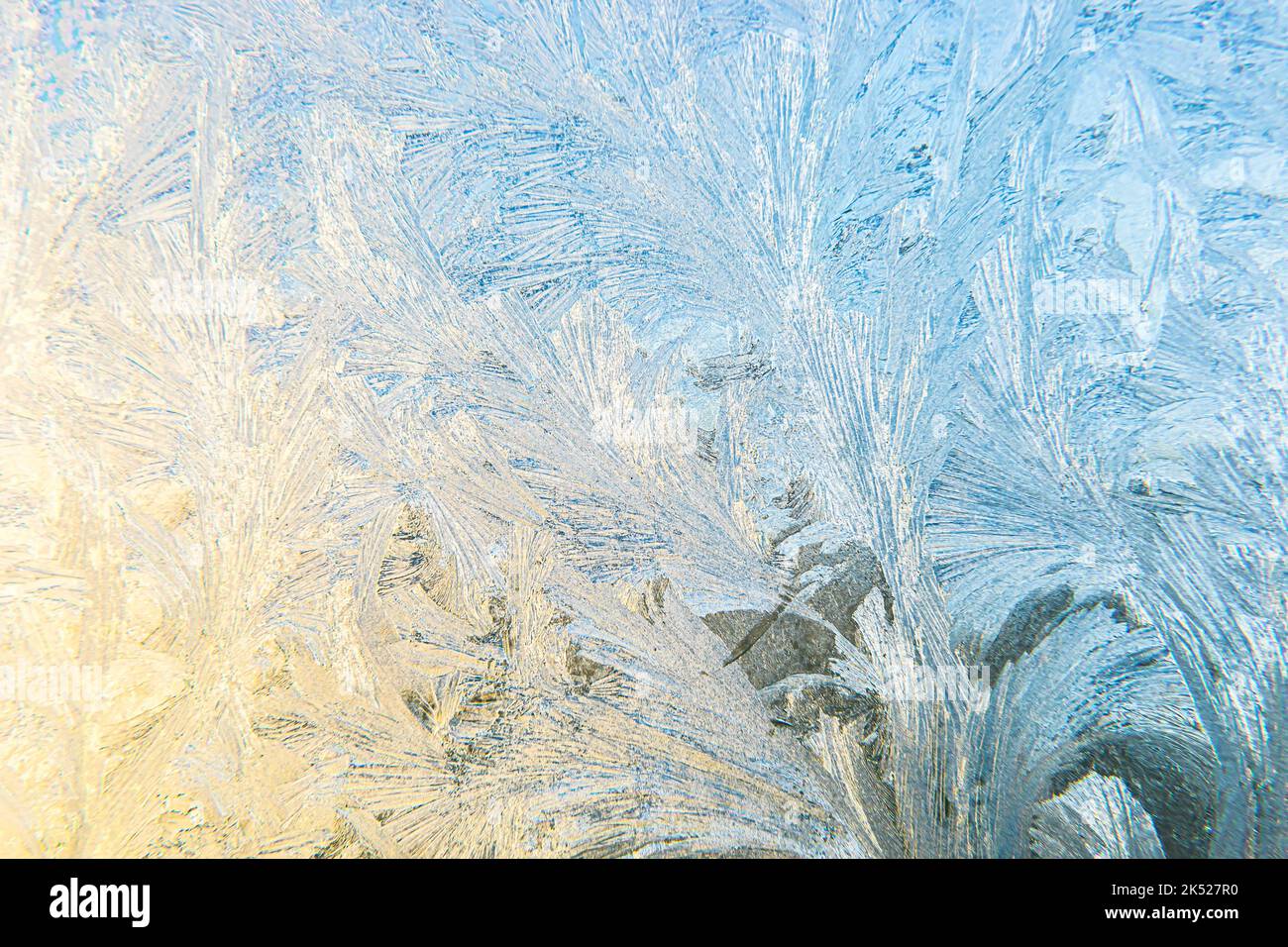 Frozen winter window with shiny ice frost pattern texture. Christmas ...