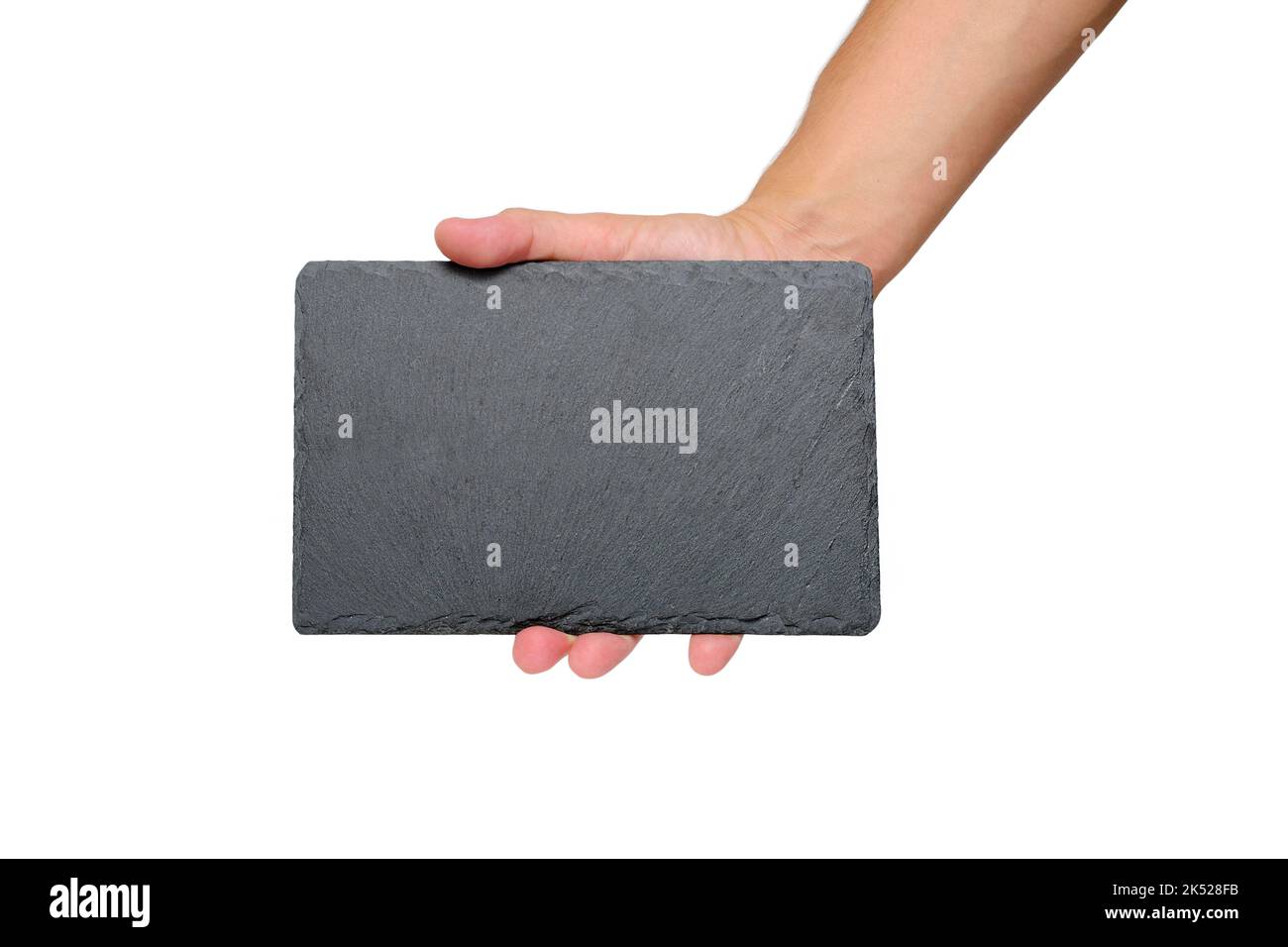 Grey stone slate cutting board with an empty space for text, in hand ...