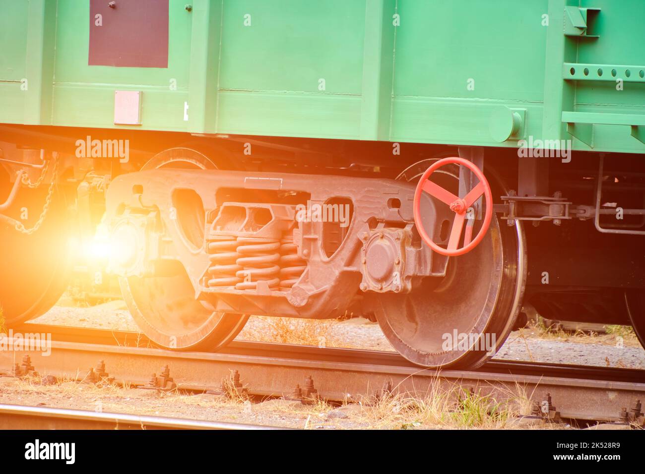 Steel wheelset of railway cars on rails.Bright solar illumination Stock ...