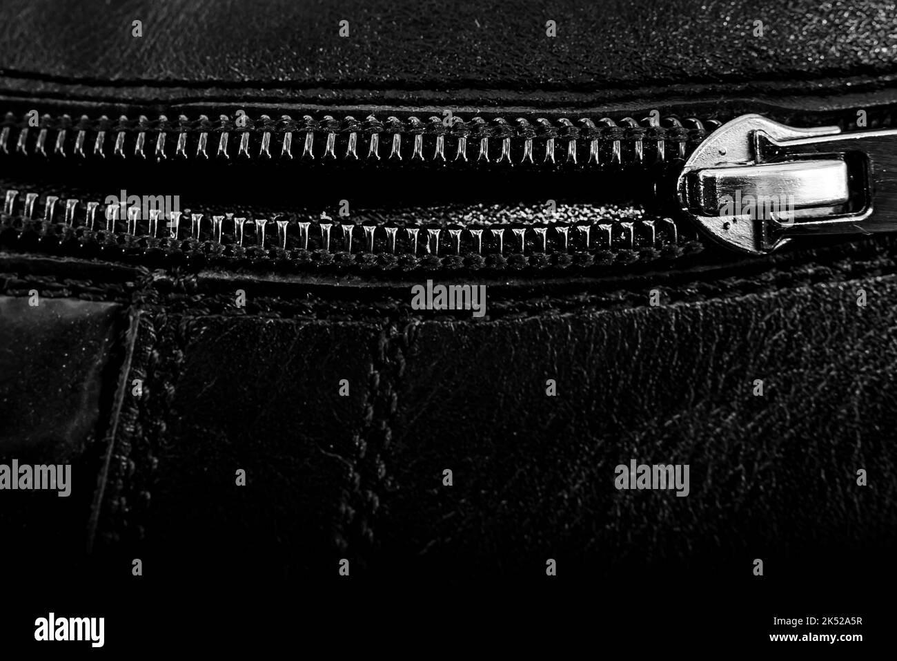 Black lock with a zipper on clothes close-up. Lock Stock Photo - Alamy