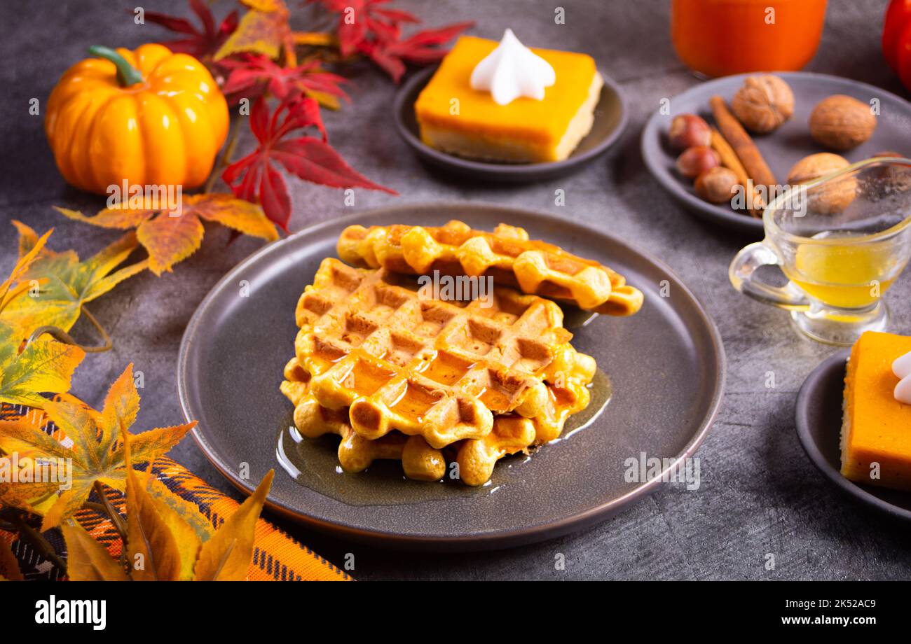 Autumn homemade pumpkin spice waffles with honey topping Stock Photo ...
