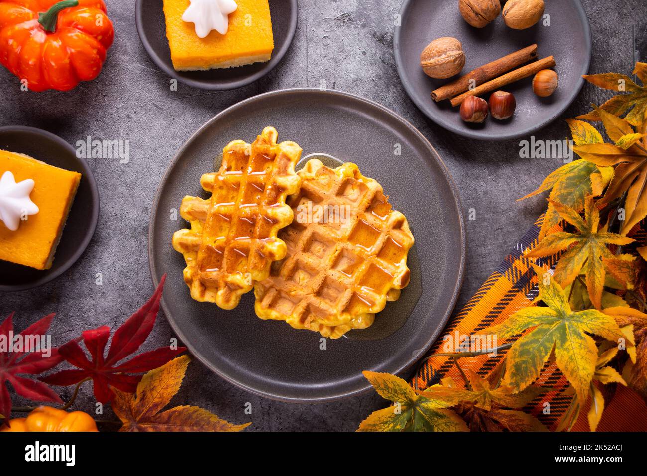 Autumn homemade pumpkin spice waffles with honey topping. Top view ...