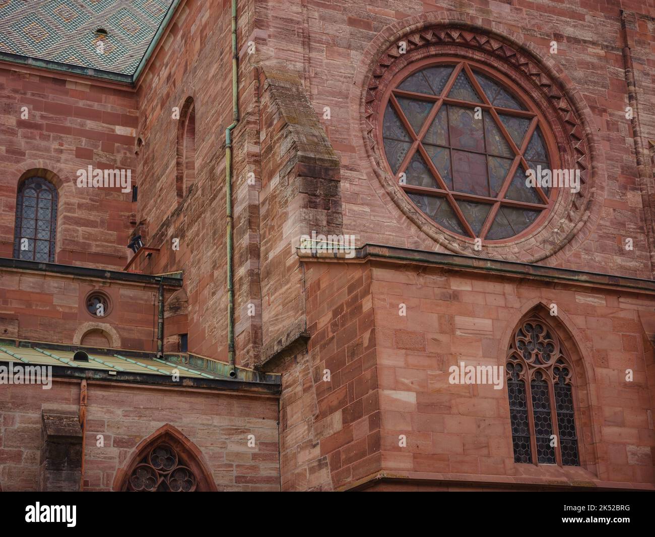 Gothic Protestant cathedral of Basel with two spiers and tiled roof ...
