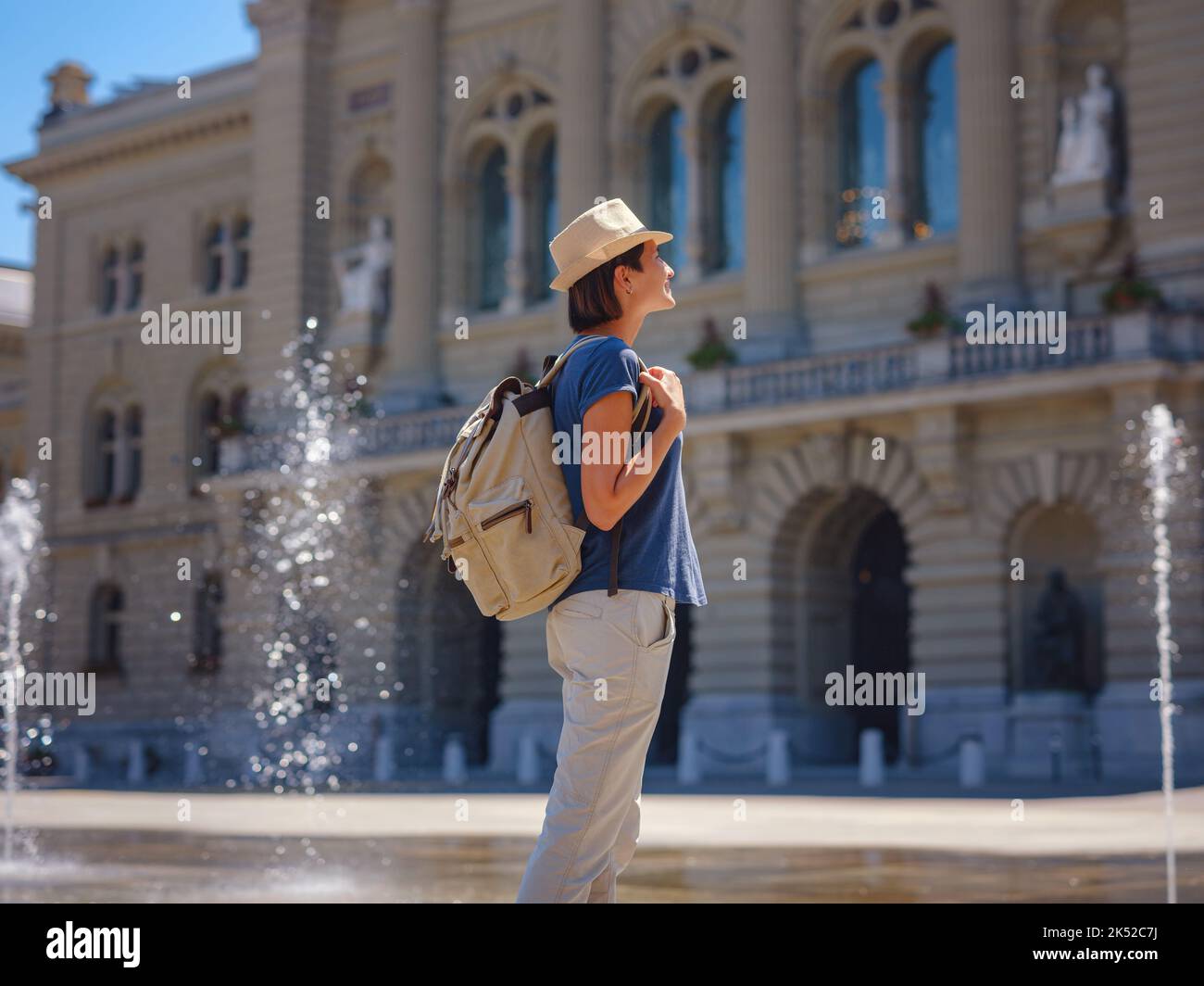 Woman having a great vacation in Switzerland, BErn, Federal palace ...