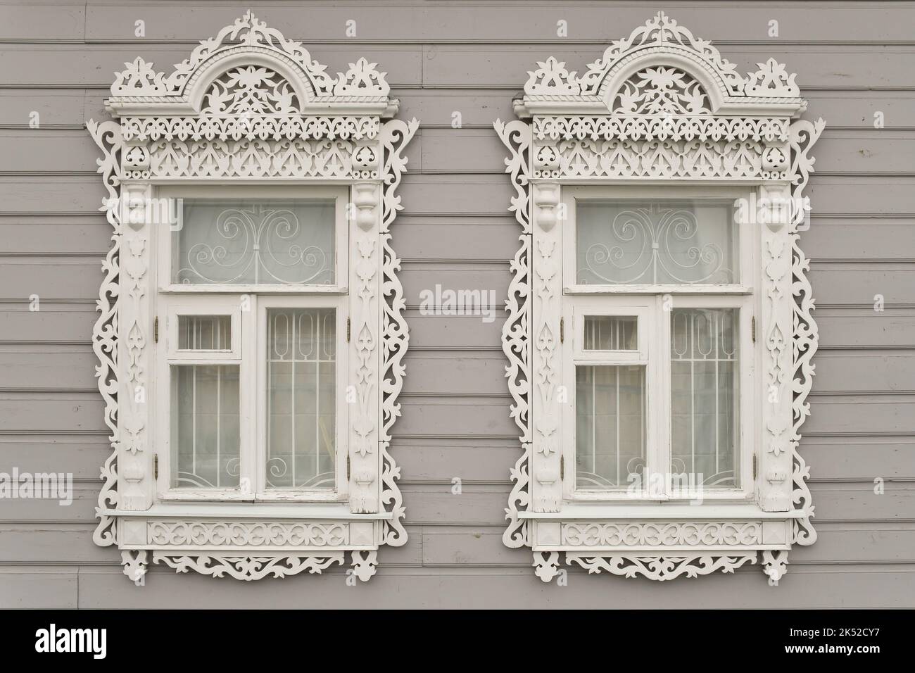 Two ornamental windows with carved frame of traditional russian rural ...