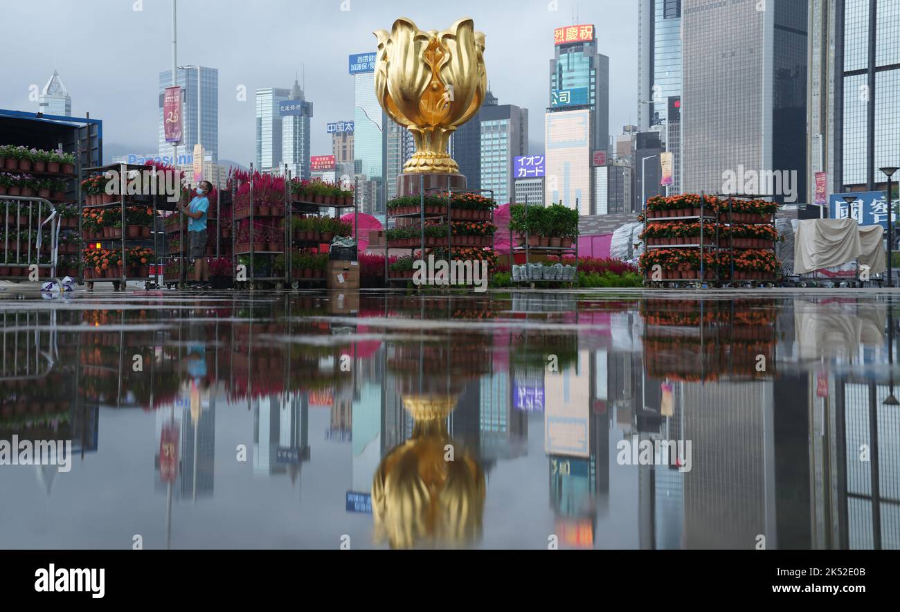 Workers prepare to celebrate the 73rd anniversary of the founding of ...