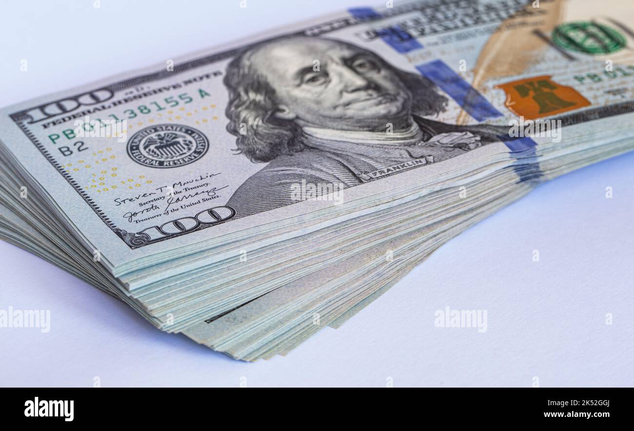 Pile of 100 dollar banknotes on white background for design purpose ...