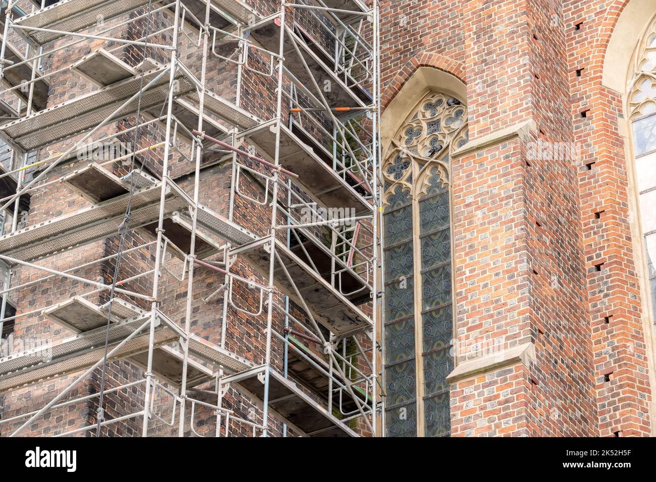 Metal scaffolding near a gothic cathedral, church, old antique ...