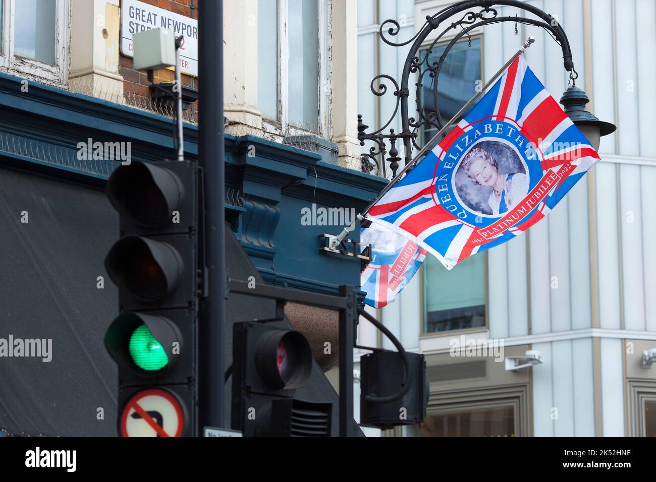A Union flag featuring a portrait of Britain’s Queen Elizabeth II is ...