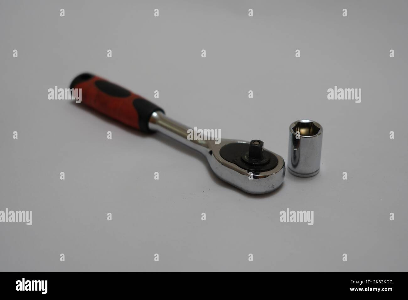 Ratchet wrench with rubberized handle with hexagonal socket which ...