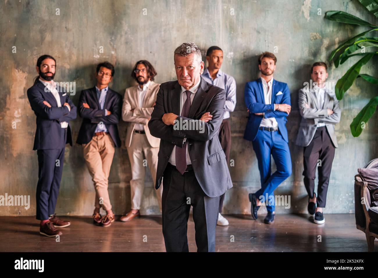 The manager of the company empowered with his young managers behind him ...