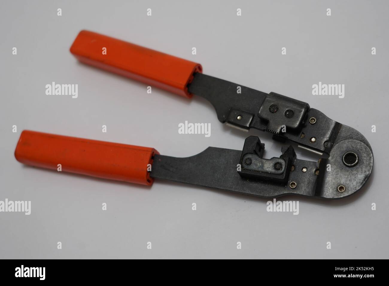 Modular plug crimper for RJ-45 and RJ-11 on white background Stock ...