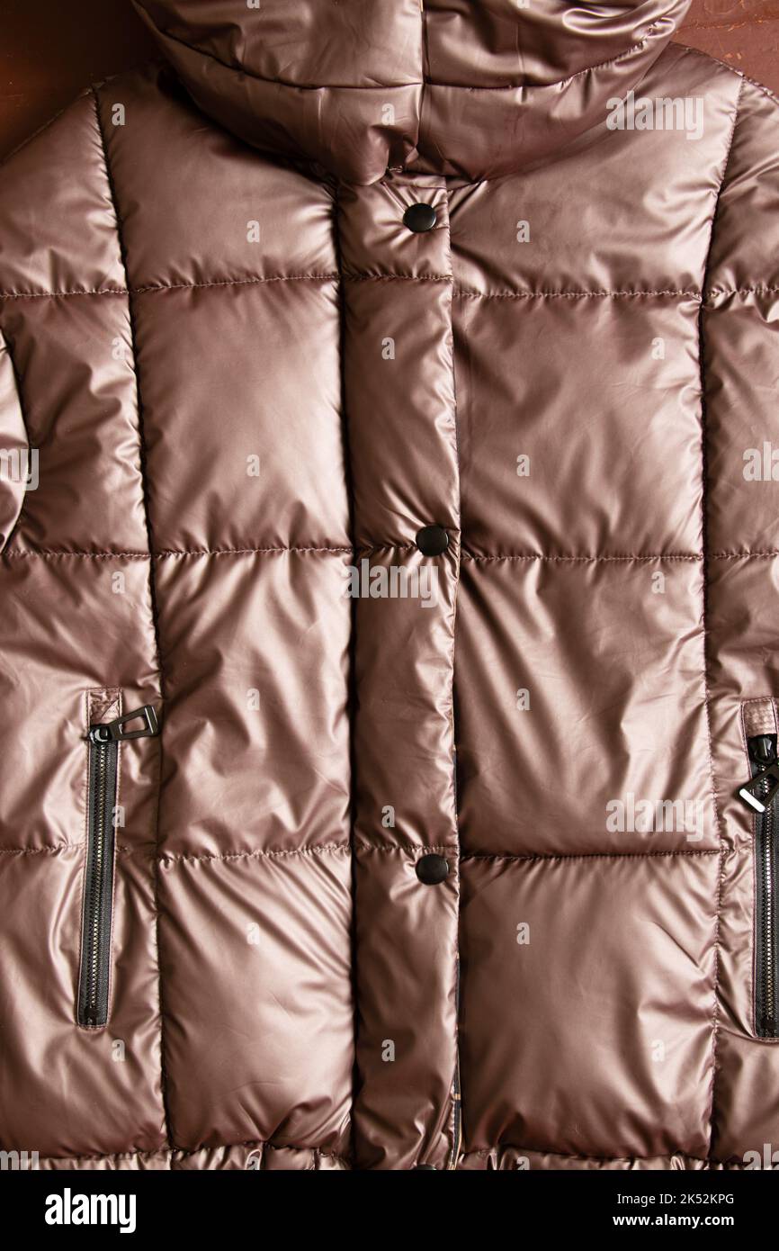 womens quilted bronze brown padded jacket as background, background of ...