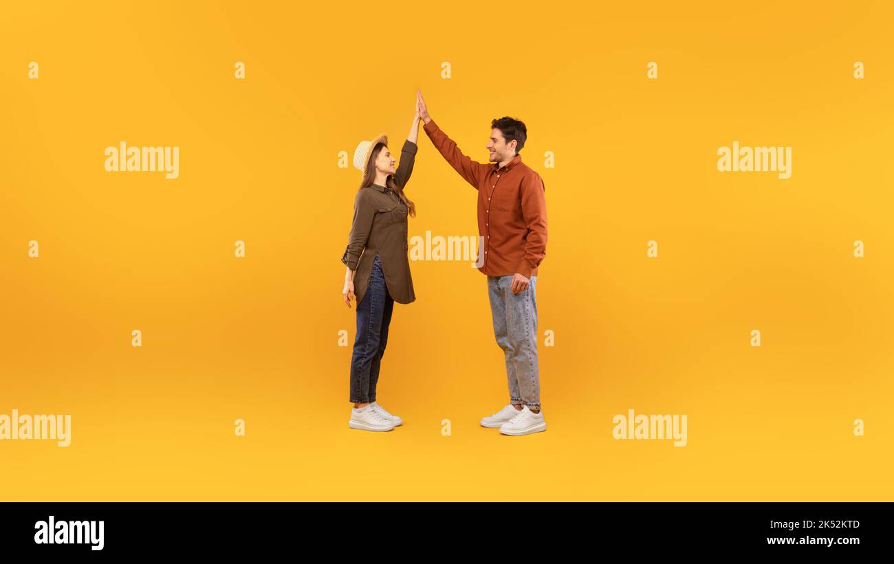 Celebrating full length high five hi-res stock photography and images ...
