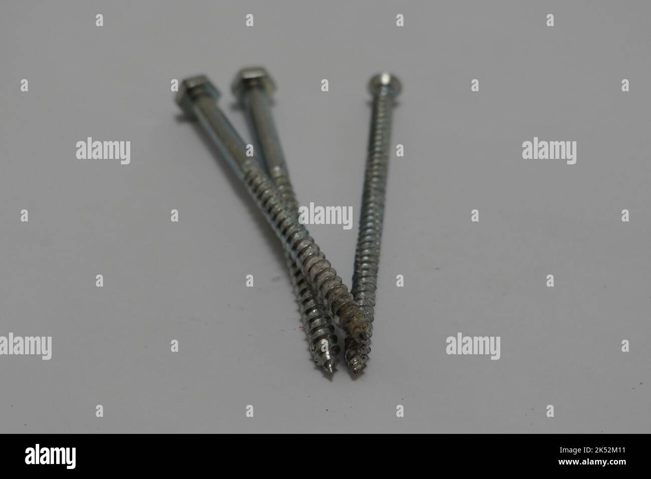 Screw background, Screw is a material that holds three objects together ...