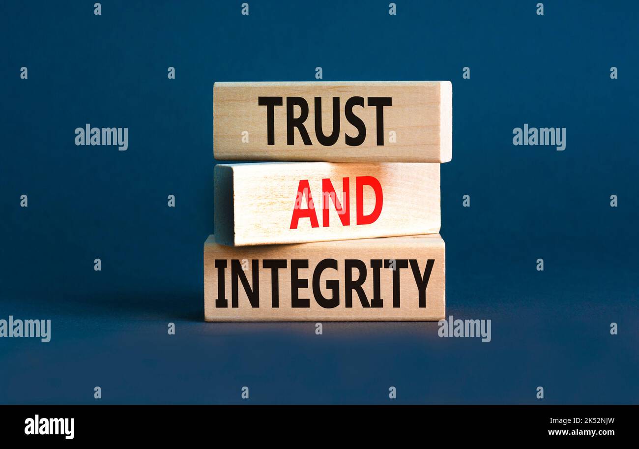 Trust and integrity symbol. Concept words Trust and integrity on wooden ...