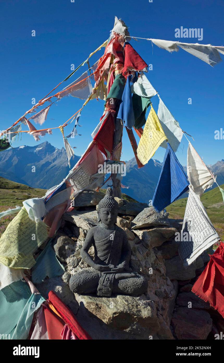 Italy, Valle d'Aosta, tour of Mont Fallère, buddha statue and prayer ...