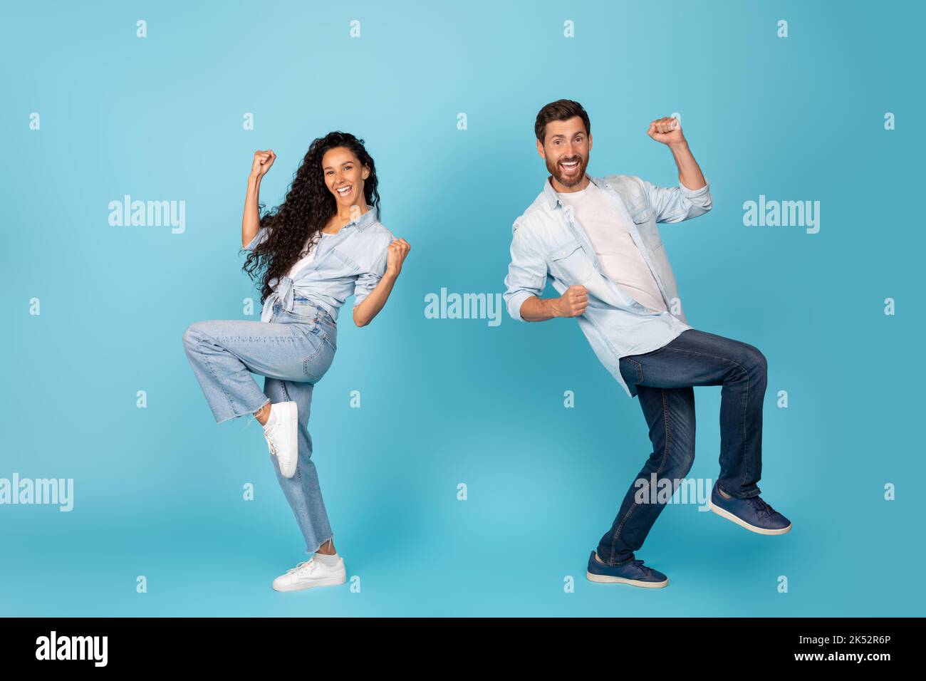 Satisfied excited young caucasian and arab people rejoice to success ...