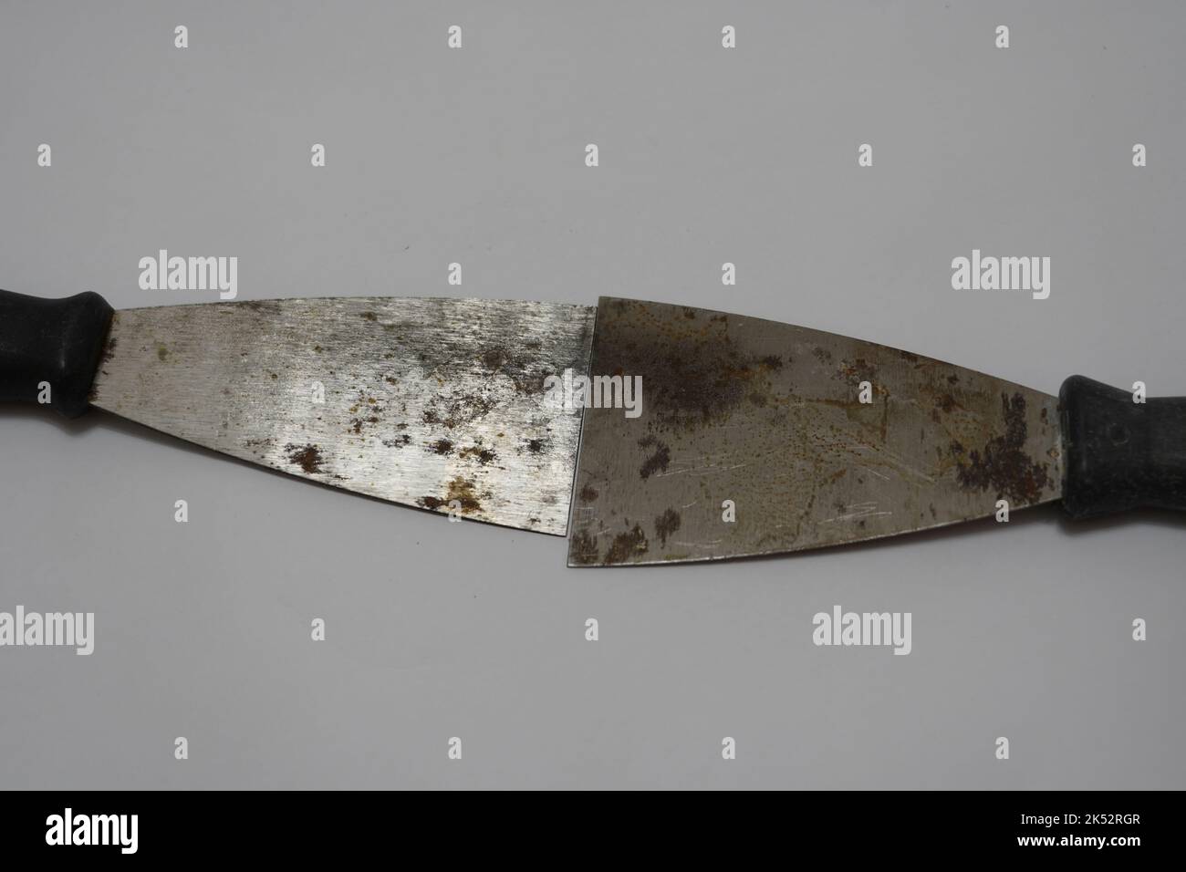 Putty knives with wooden handles, Closeup a new metallic putty knife ...