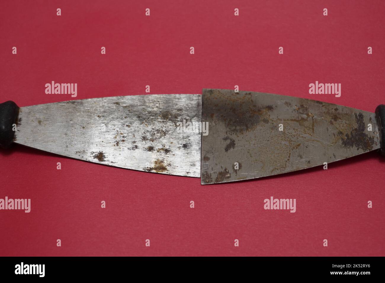 Putty knives with wooden handles, Closeup a new metallic putty knife ...