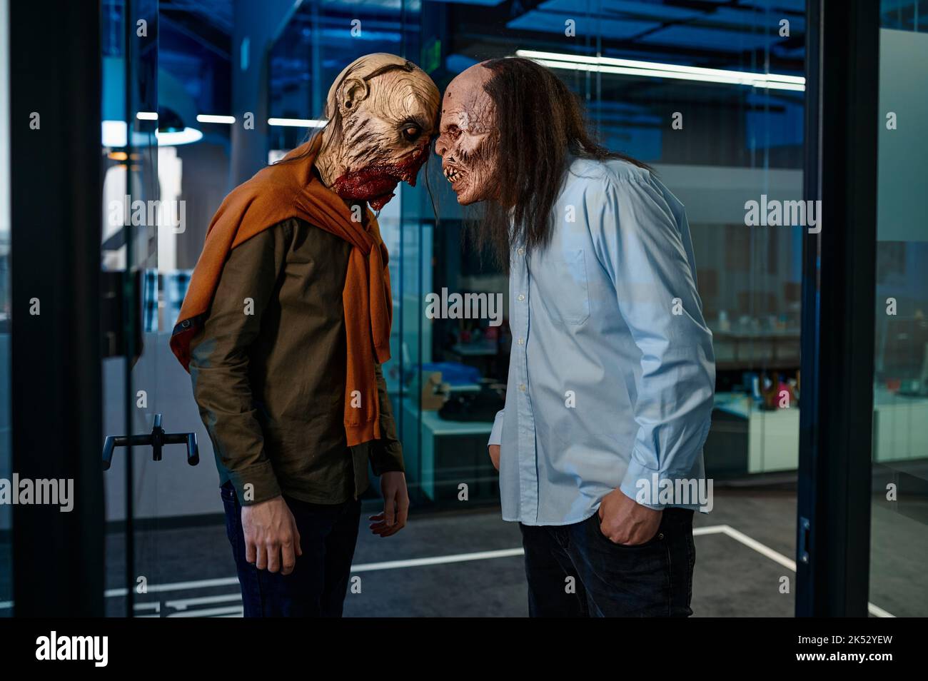 Angry zombie business partners looking at each other Stock Photo - Alamy