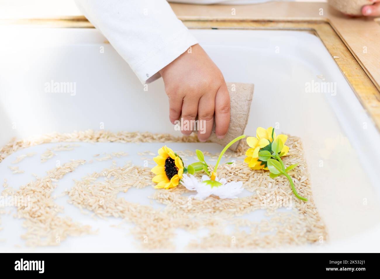 Rice sensory play Stock Photo - Alamy