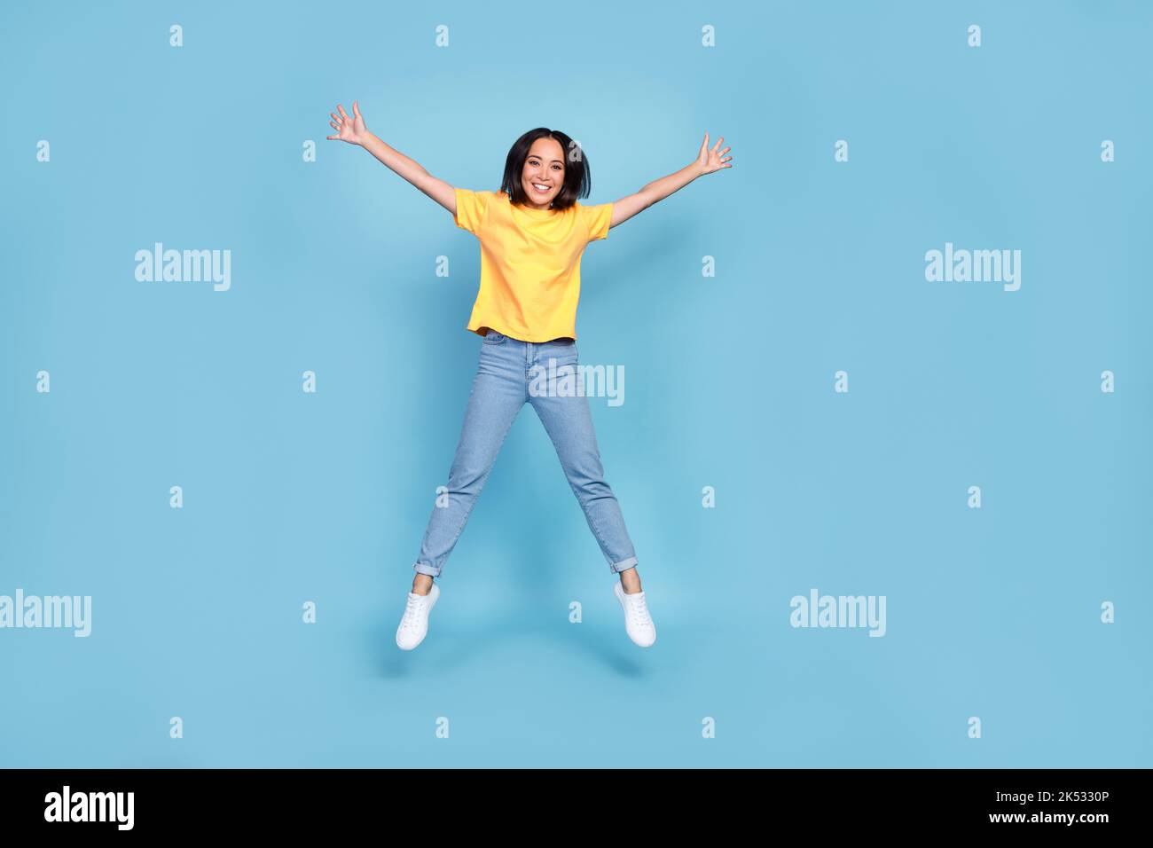Full size photo of charming cheerful girl jumping make star figure ...