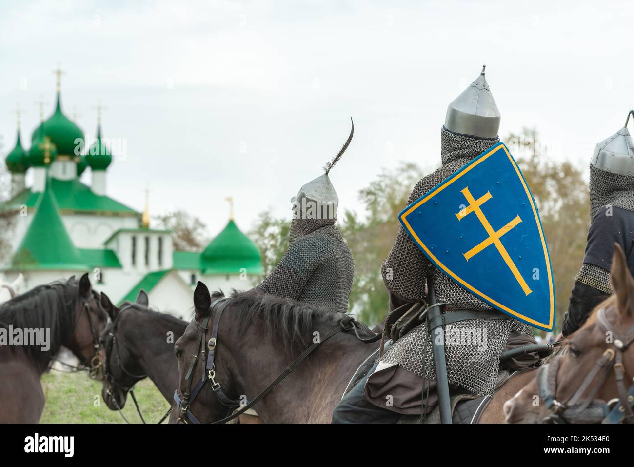Horsemans in chain mail armor and christian shield on a background of ...