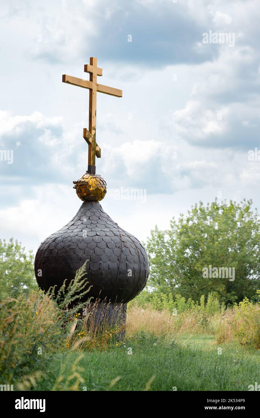 Old russsian chirch tip with golden cross separate bring down on ground ...