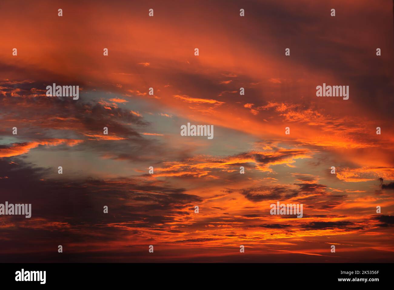Dramatic sunset sky with colorful clouds and sun lights with vivid ...