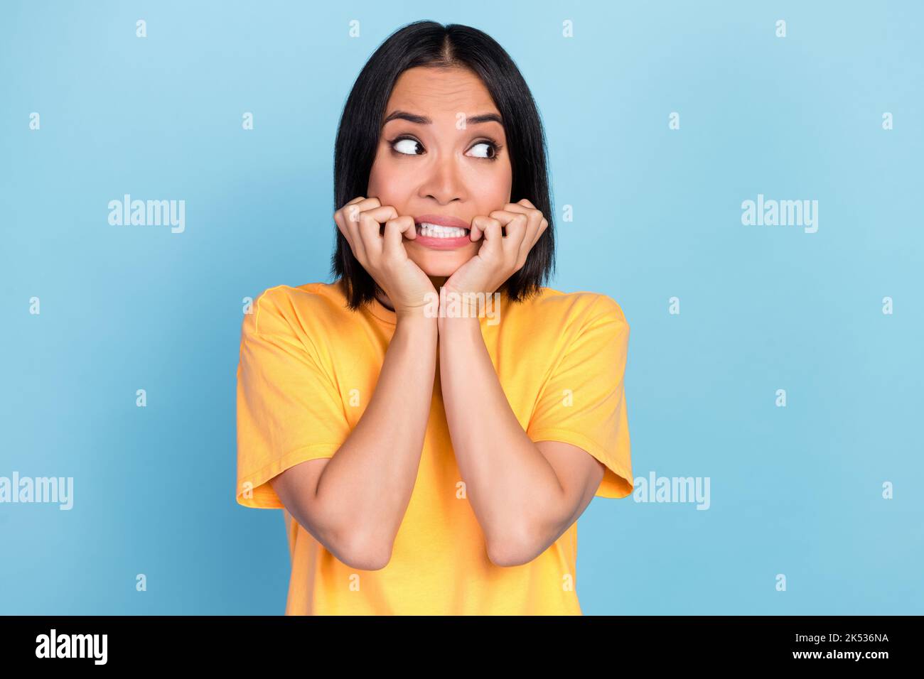Photo of horrified scared cute woman with bob hairstyle wear yellow t ...