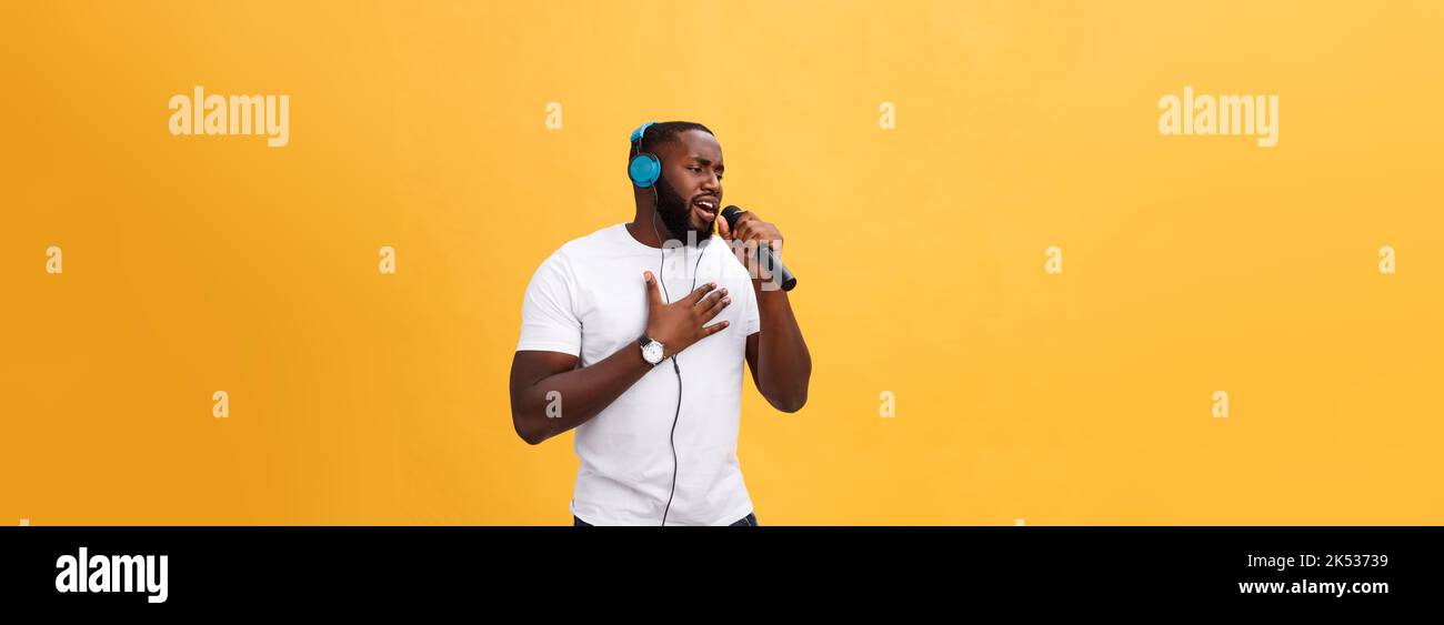 Portrait of cheerful positive chic handsome african man holding ...