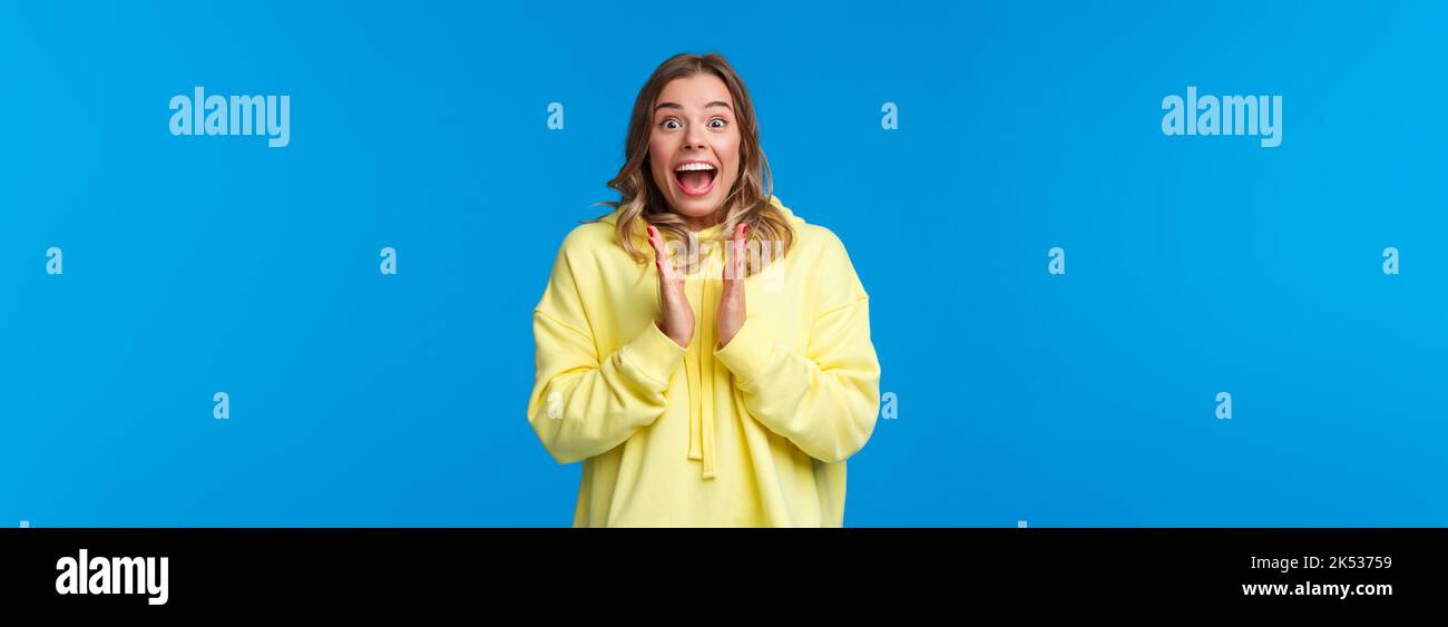 Wow thats awesome. Imrpessed and happy cheerful blond girl clap hands ...