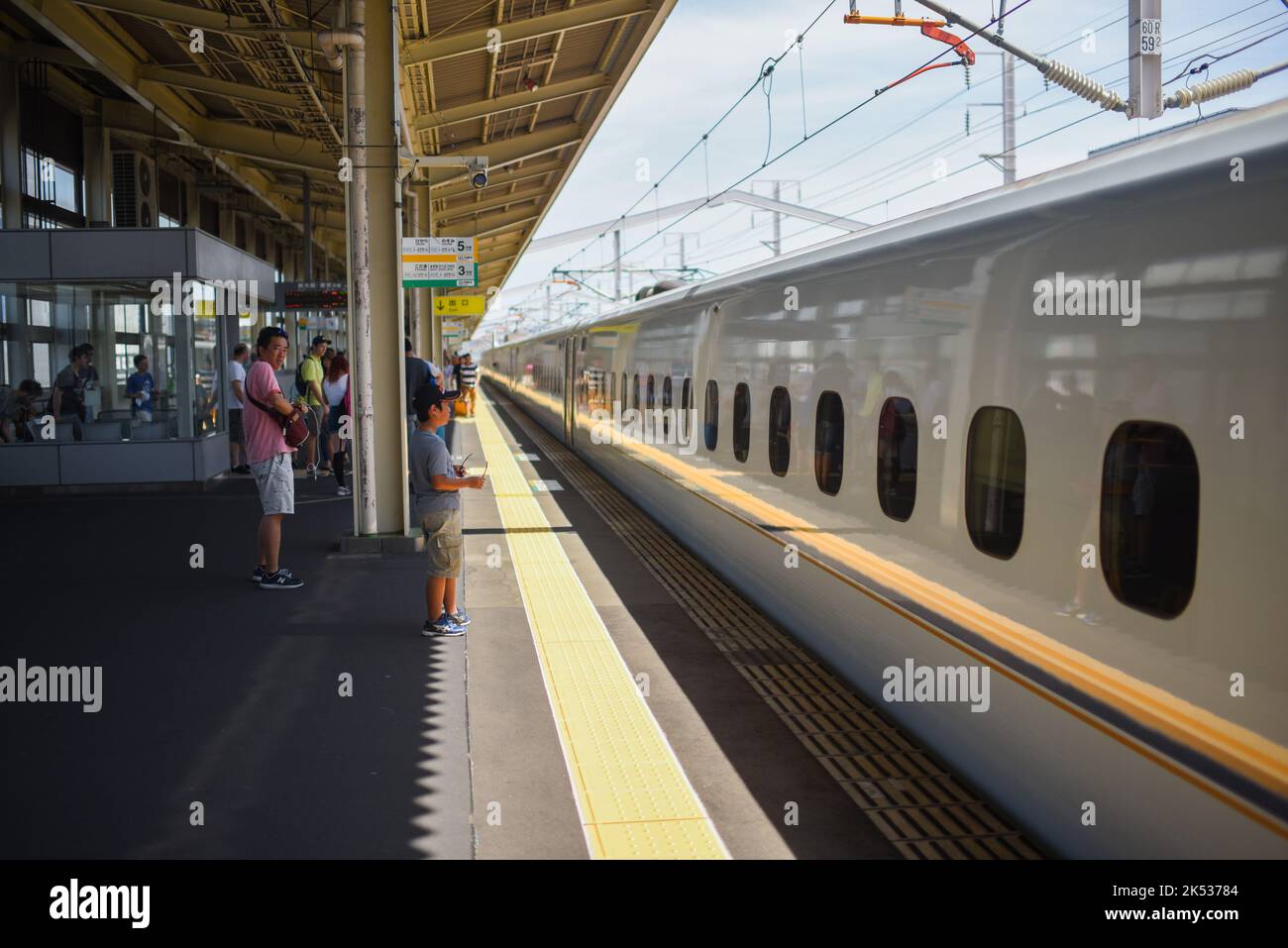 People wait for Shinkansen train, Japan Stock Photo - Alamy