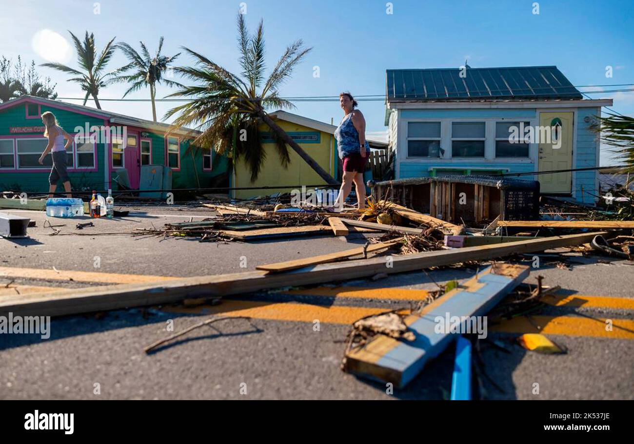 Donna LaMountain, 51, surveys damage on Pine Island Road on Thursday ...