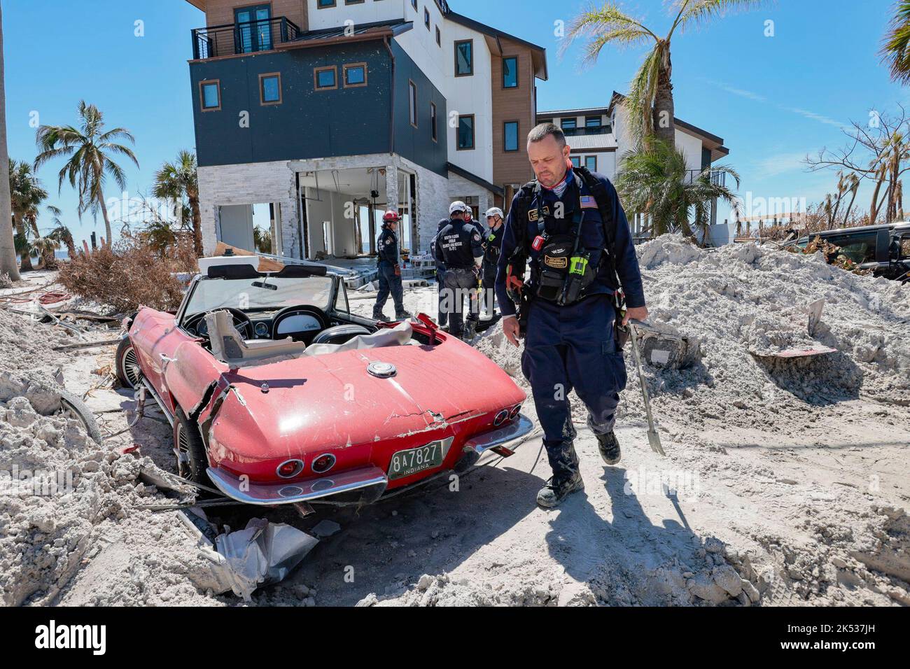 An Urban Search and Rescue Florida Task Force 2 team member walks past ...