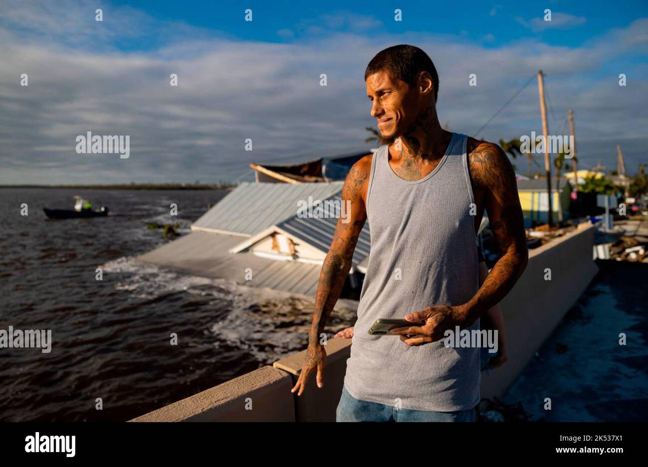 Jason Diamond, 41, and his daughter, Layla Diamond, 13, survey damage ...