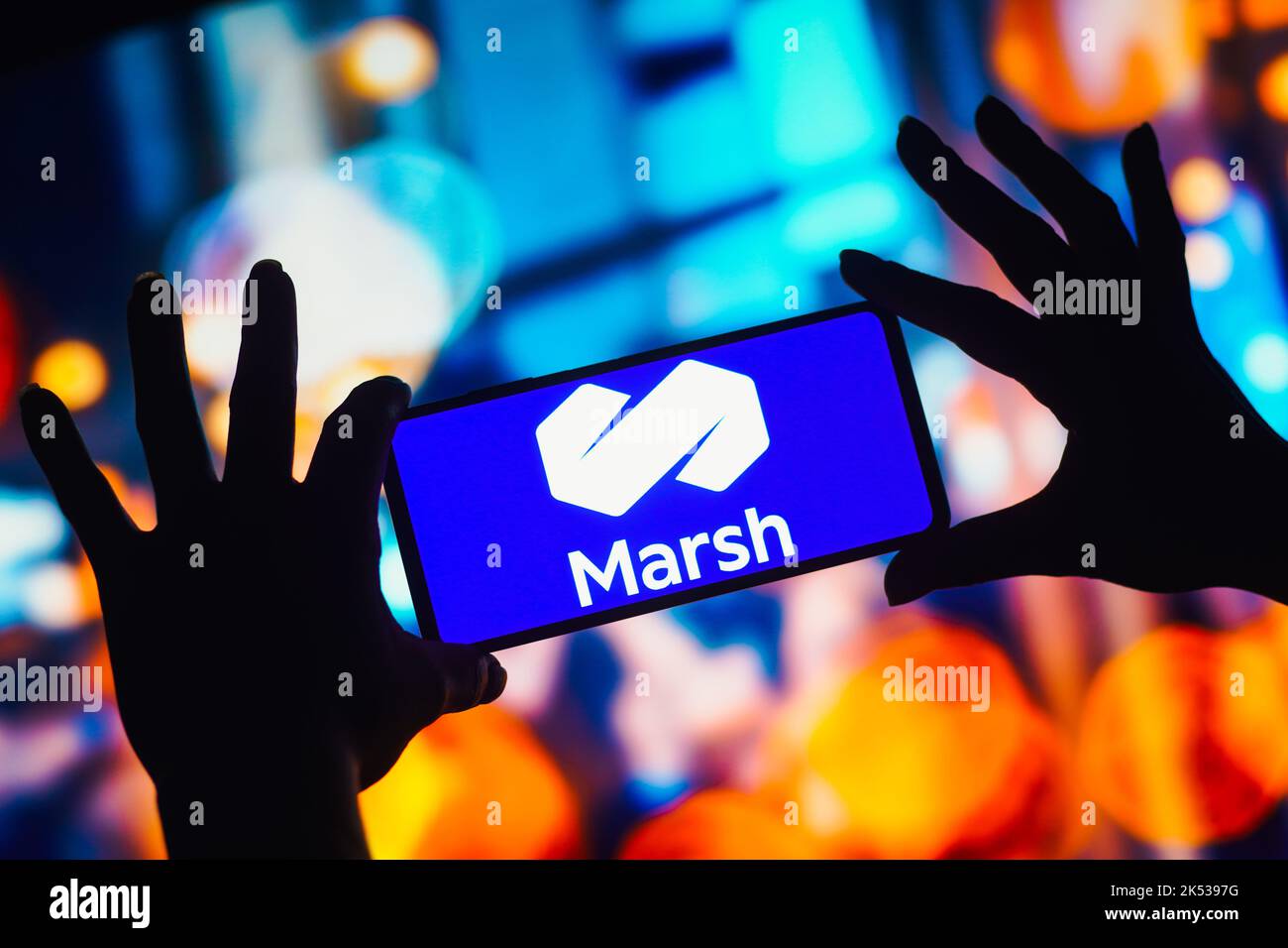In this photo illustration, the Marsh logo is seen displayed on a ...