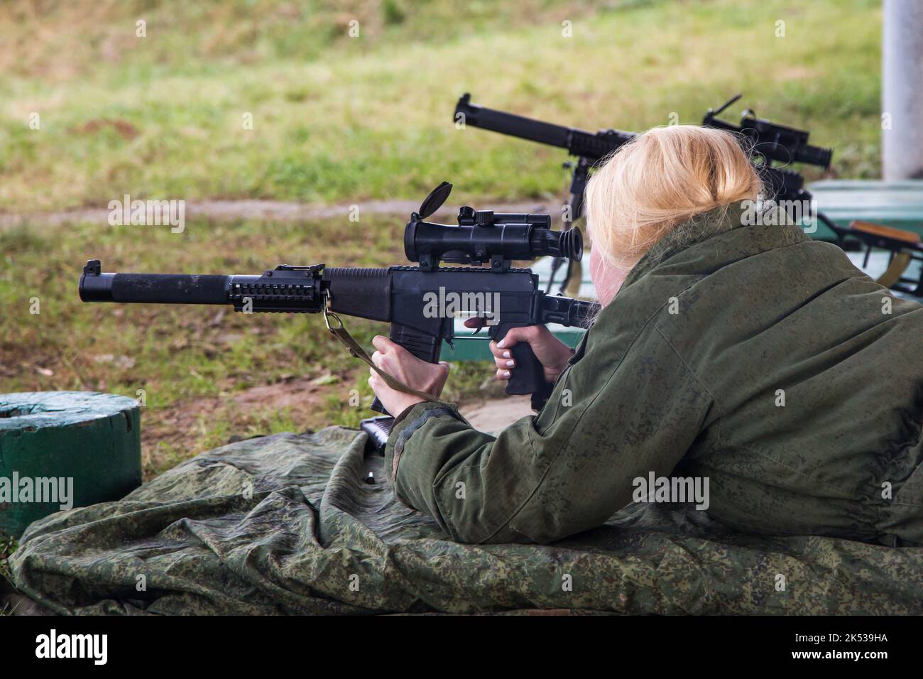 Man shooting at a target. Unformal shooting range Stock Photo - Alamy