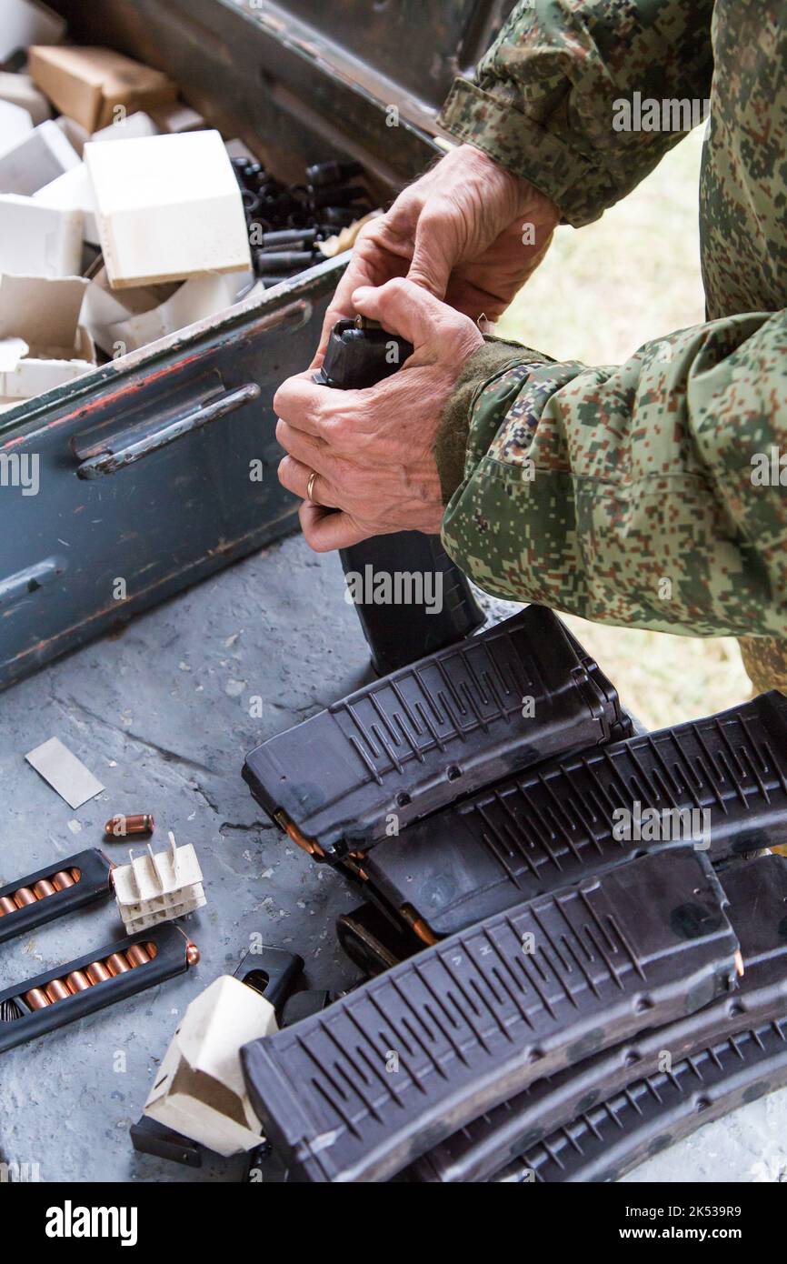 Soldier hands load rifle machine gun bullets into cartridge clip Stock ...