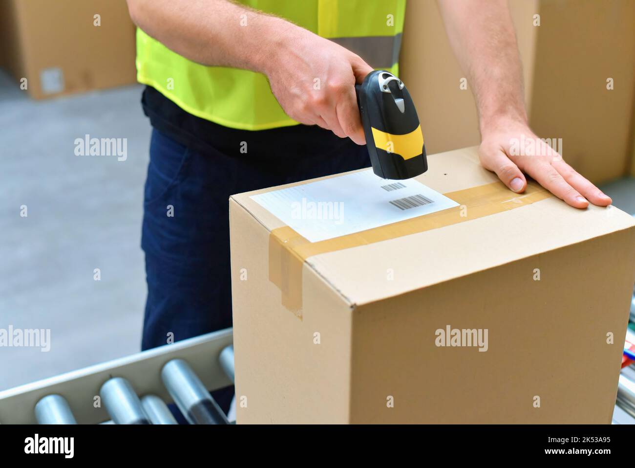 workers in the warehouse scanning parcels for retail and transport ...