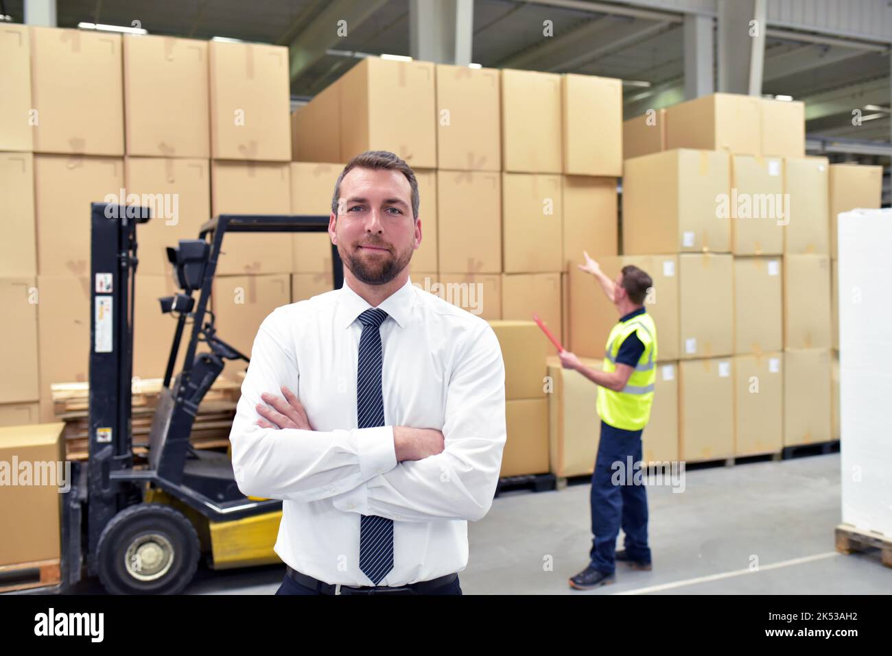 manager of a logistics company trading in a warehouse Stock Photo - Alamy