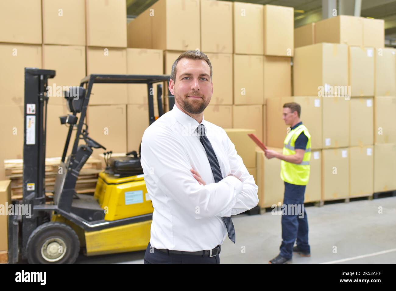 manager of a logistics company trading in a warehouse Stock Photo - Alamy