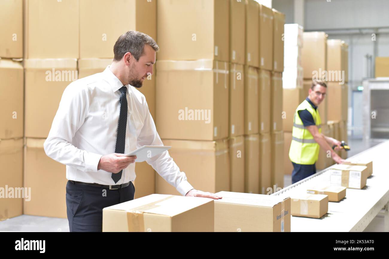 Worker in a warehouse in the logistics sector - transport and ...