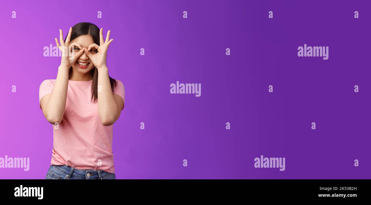 Cheerful friendly carefree asian woman having fun fool around, show ...